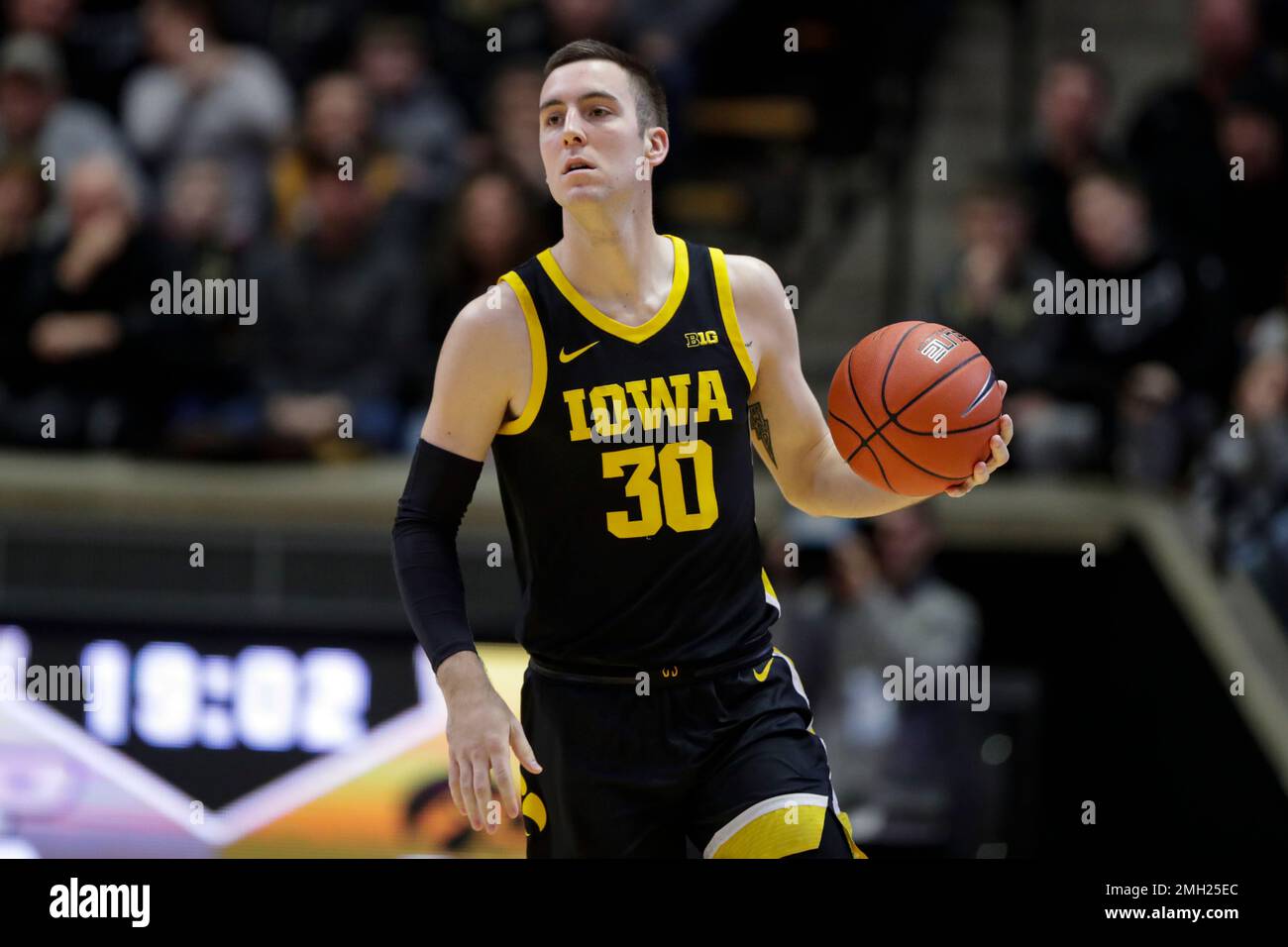 Iowa guard Connor McCaffery (30) plays against Purdue during the first ...