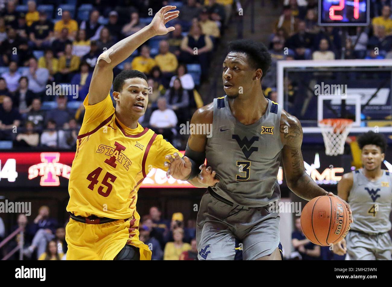 West Virginia forward Gabe Osabuohien (3) looks to pass the ball as he ...