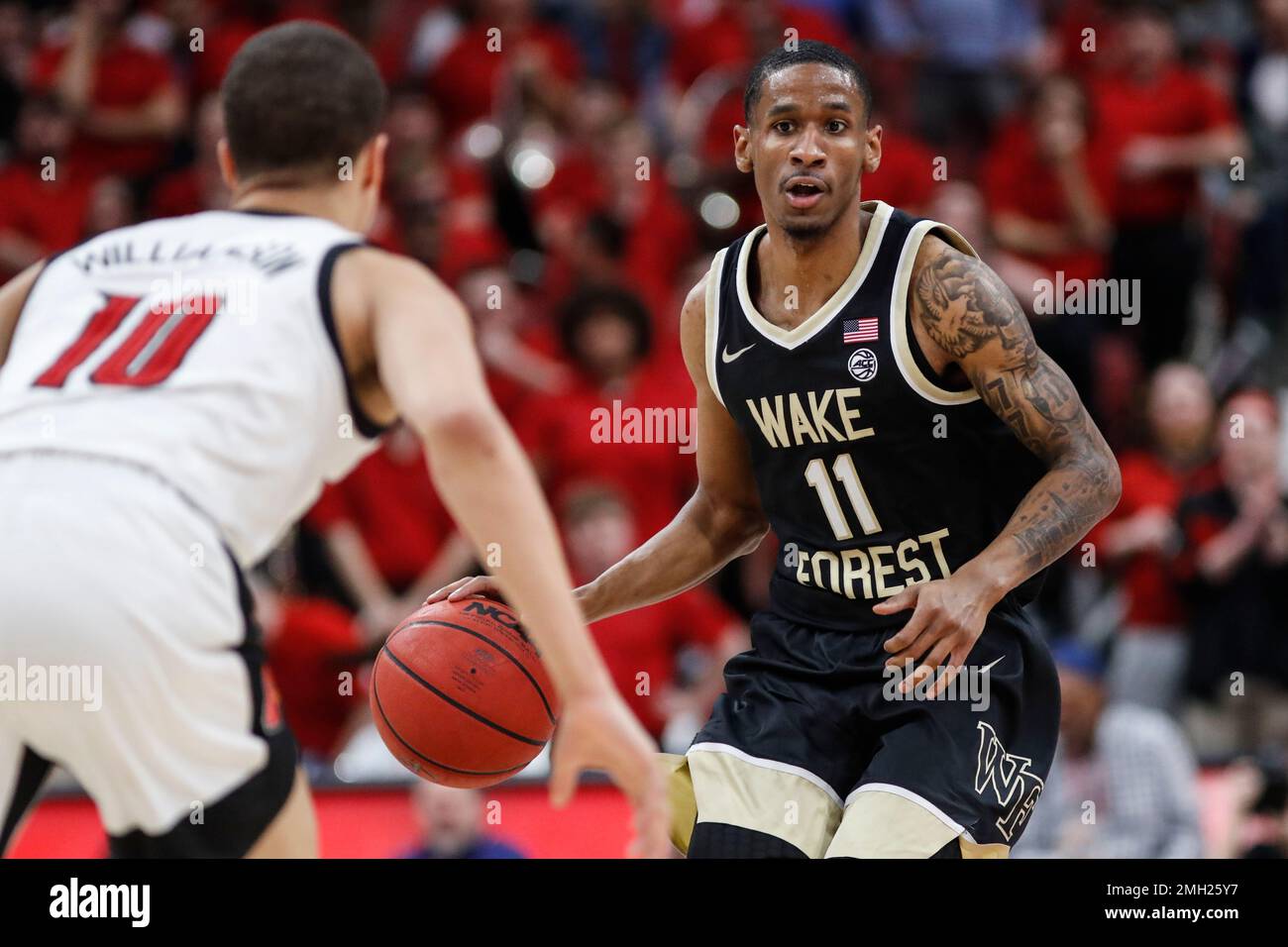 Wake Forest guard Torry Johnson (11) brings the ball up as he is ...
