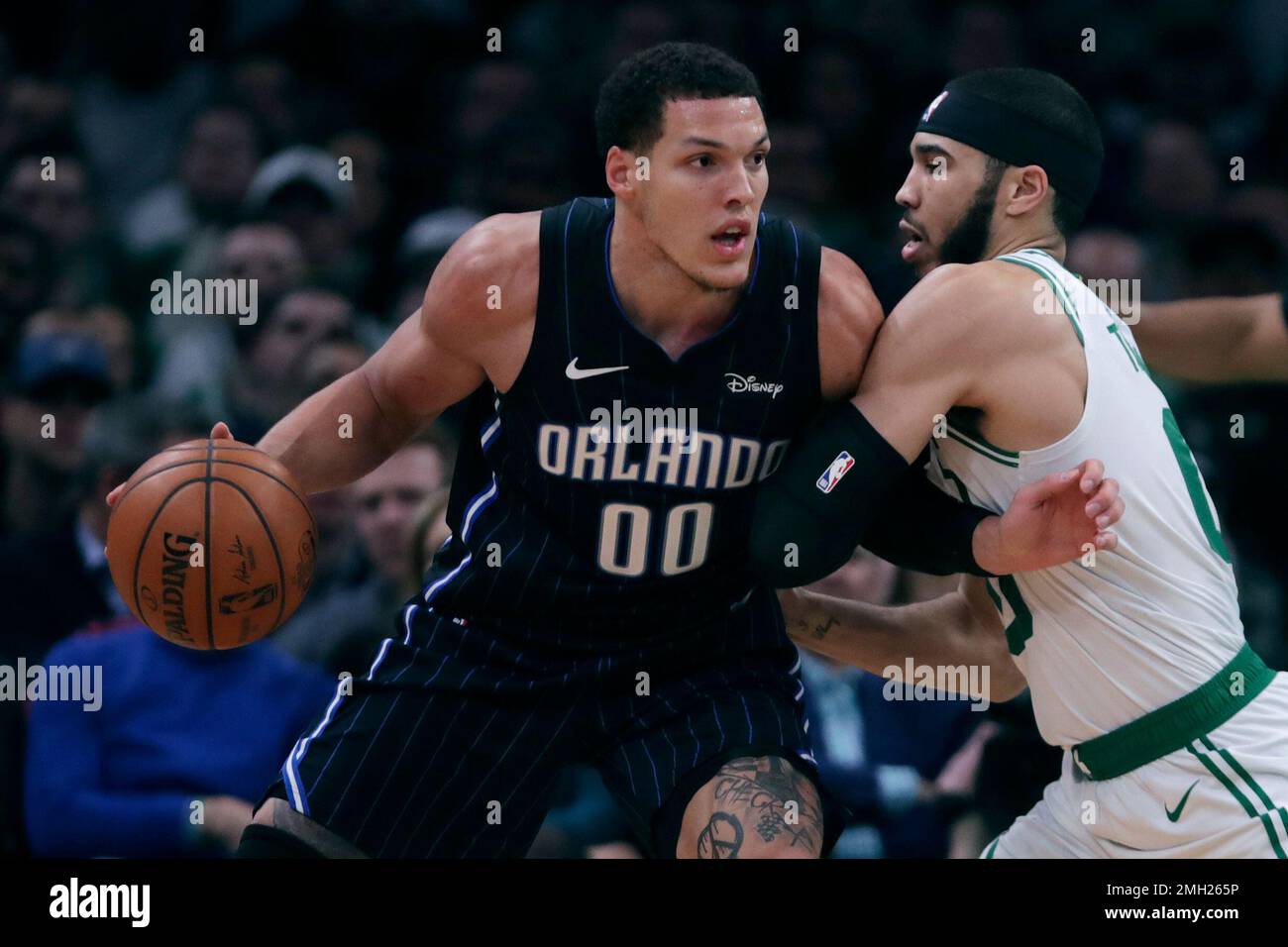 Boston Celtics forward Jayson Tatum, right, tries to stop Orlando Magic ...