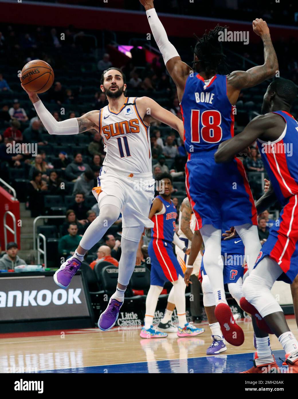 Phoenix Suns guard Ricky Rubio (11) passes as Detroit Pistons guard ...