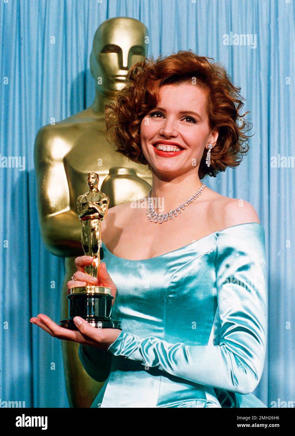 FILE - This March 30, 1989 file photo shows Geena Davis holding her ...
