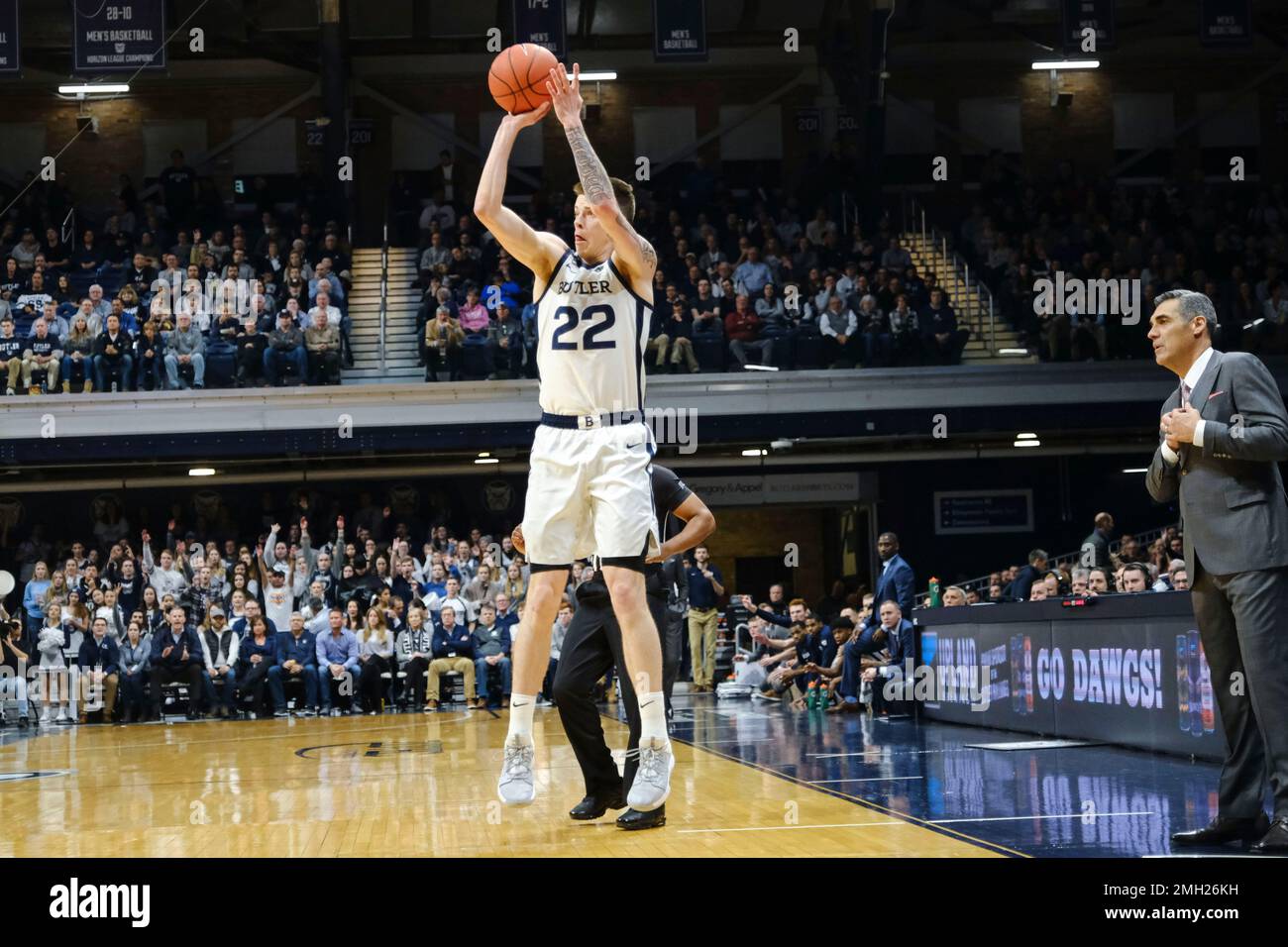 Butler forward Sean McDermott (22) shoots next to Villanova coach Jay ...