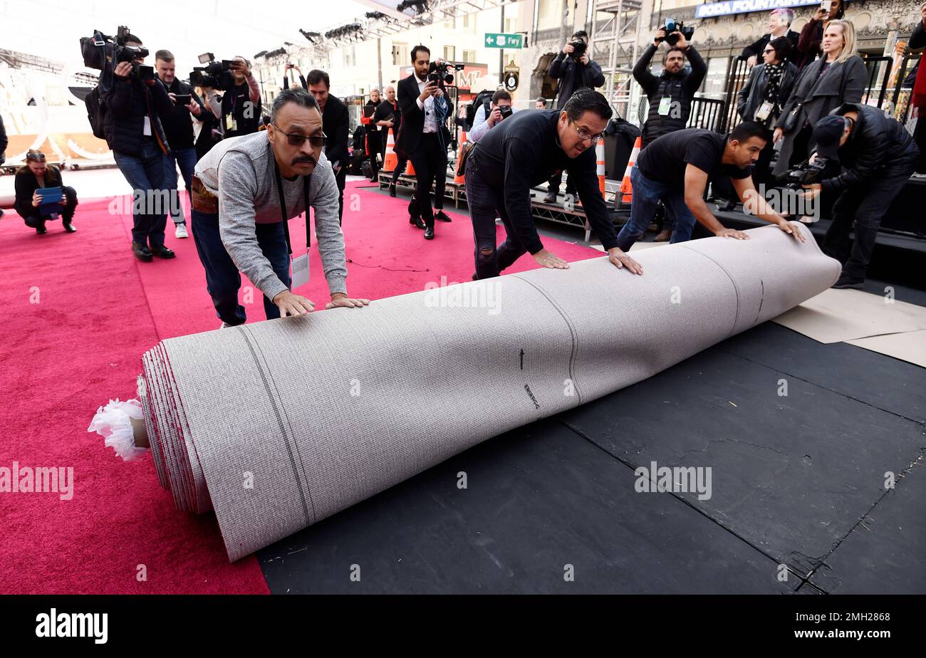 Crew workers Pascual Rosas, from left, Rudy Morales and Pablo Cruz roll ...