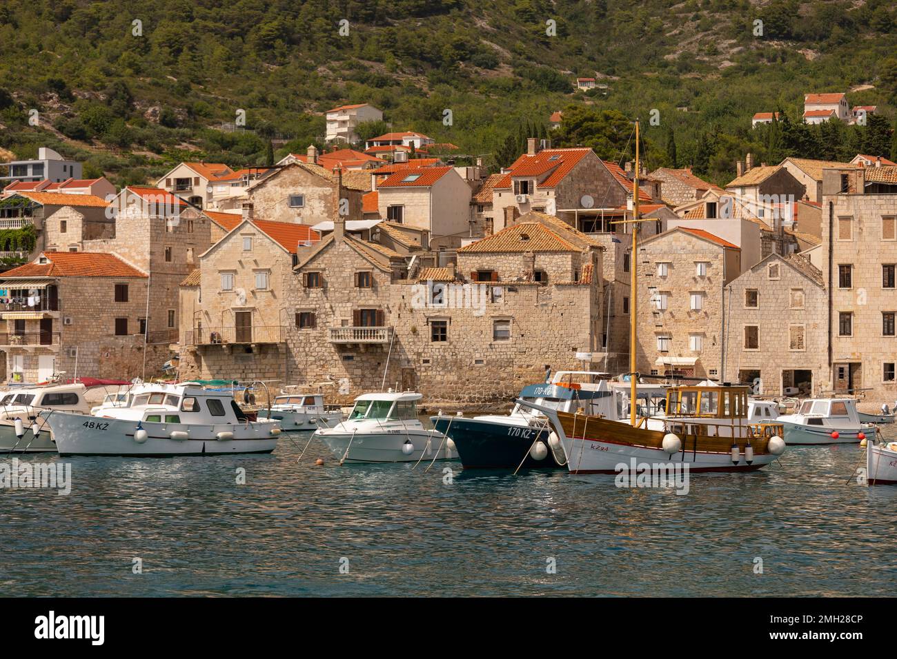 KOMIZA, CROATIA, EUROPE - Boats in harbor of coastal town of Komiza, on ...