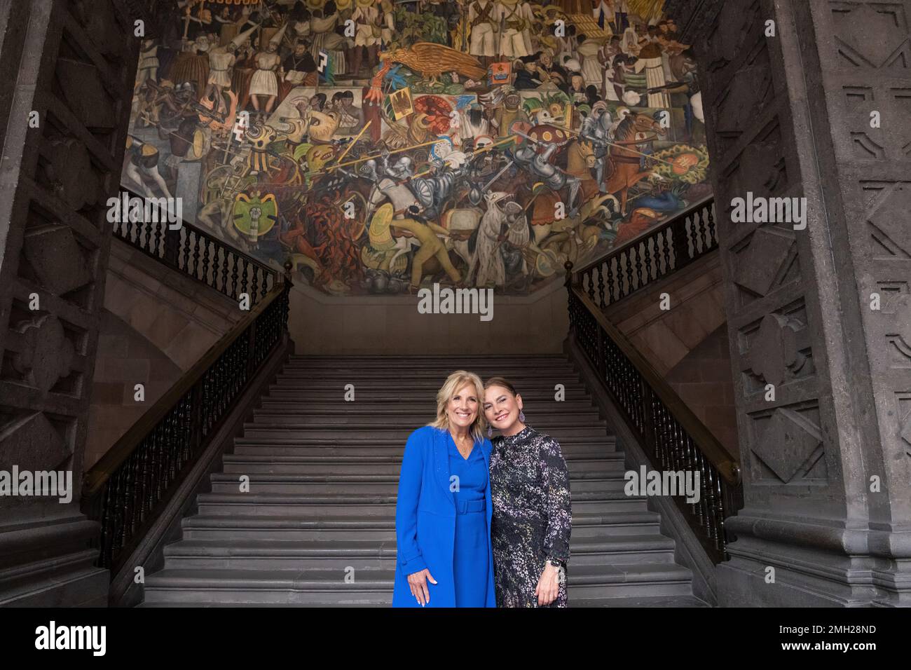 First Lady Jill Biden poses for a photo by Diego Rivera’s mural “The ...
