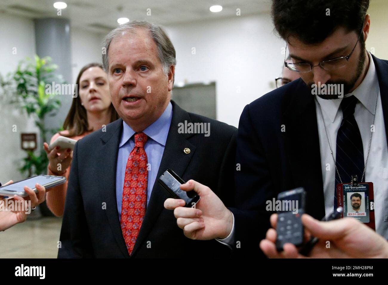 Sen. Doug Jones, D-Ala., speaks with reporters on Capitol Hill in ...