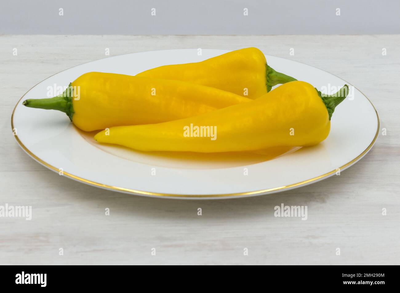 Yellow ramiro pepper is prepared for use in the preparation of a salad ...