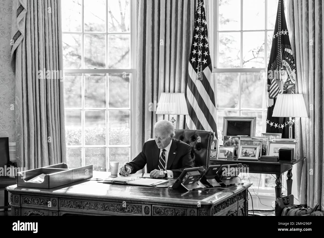President Joe Biden works in the Oval Office, Friday, January 13, 2023 ...