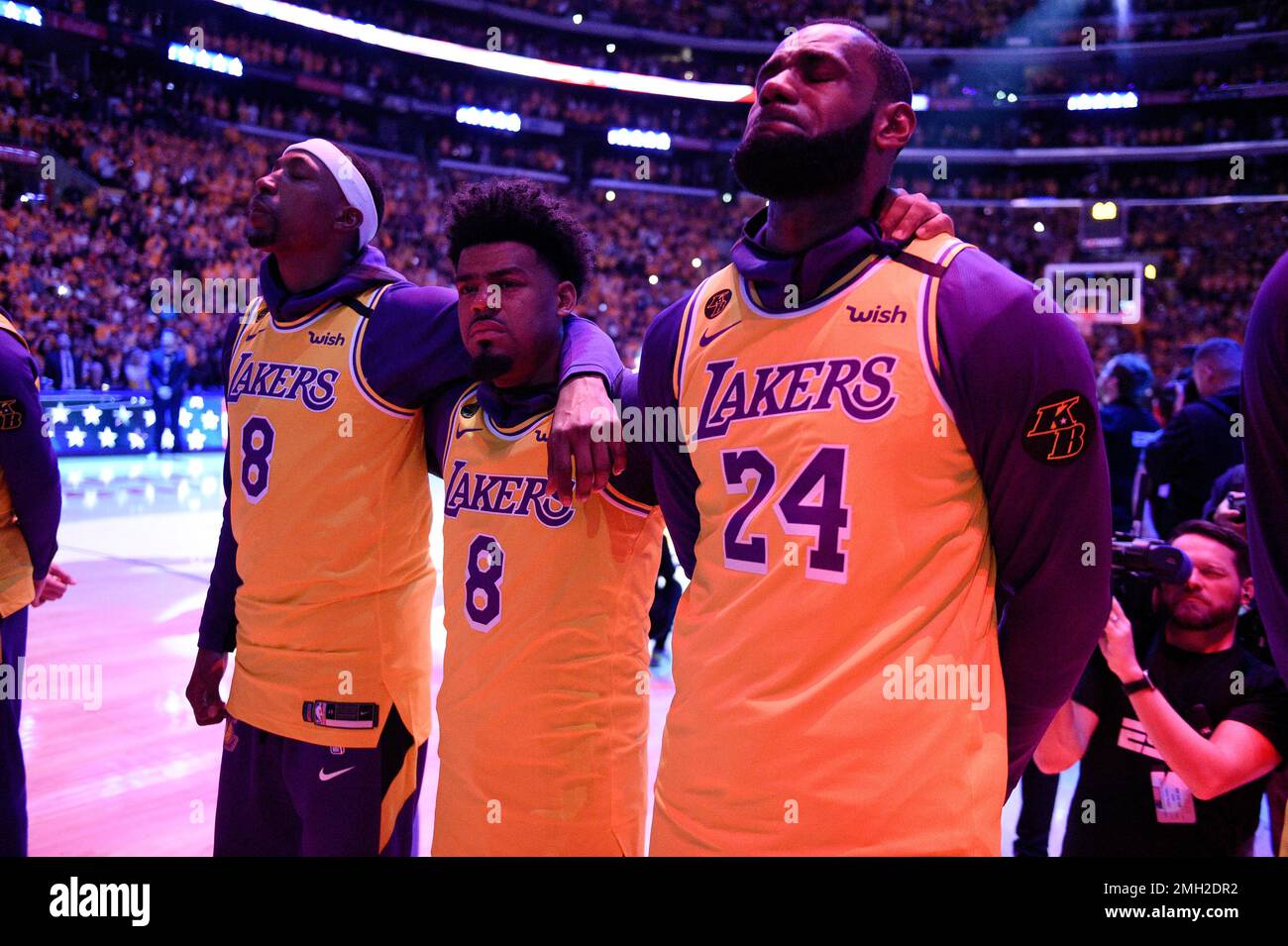 Los Angeles Lakers' Kentavious Caldwell-Pope, left, stands with Quinn ...