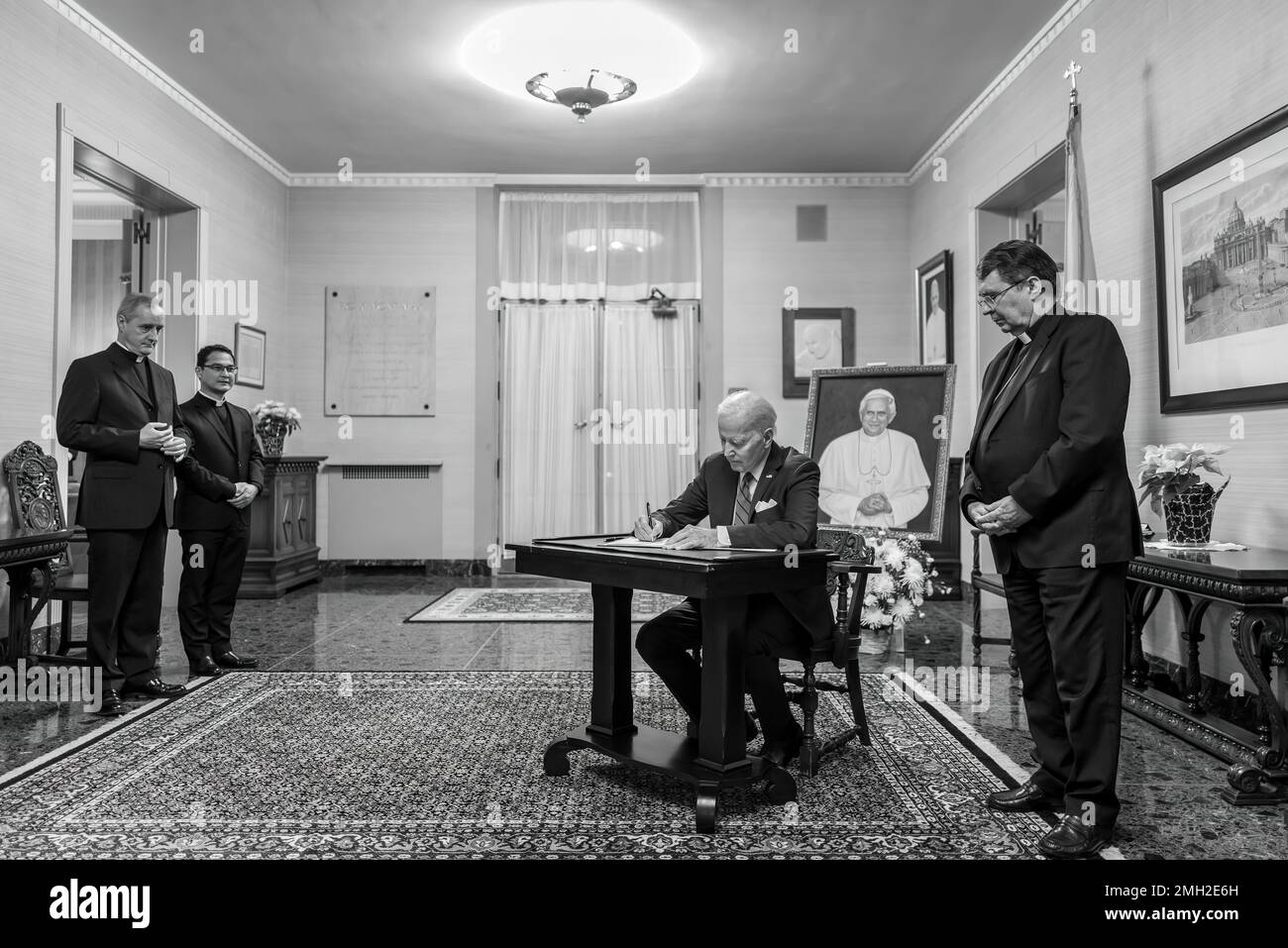 President Joe Biden signs a condolence book for Pope Emeritus Benedict ...