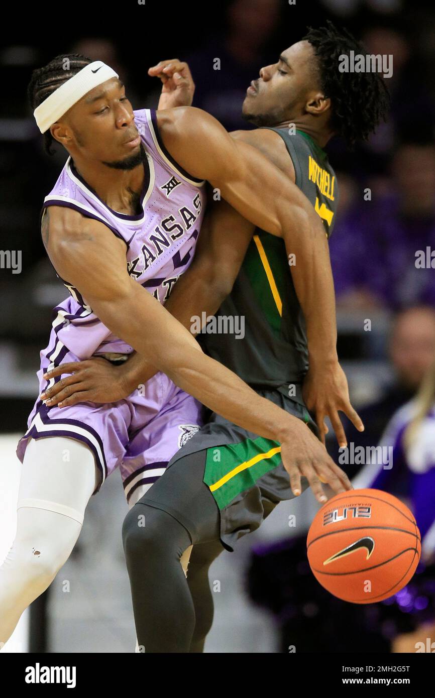 Kansas State forward Xavier Sneed, left, tries to get around Baylor ...