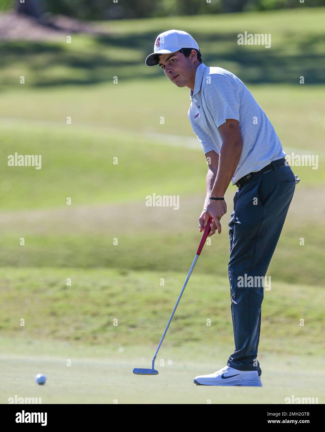 Florida golfer Fred Biondi putts on the ninth during the first round of ...