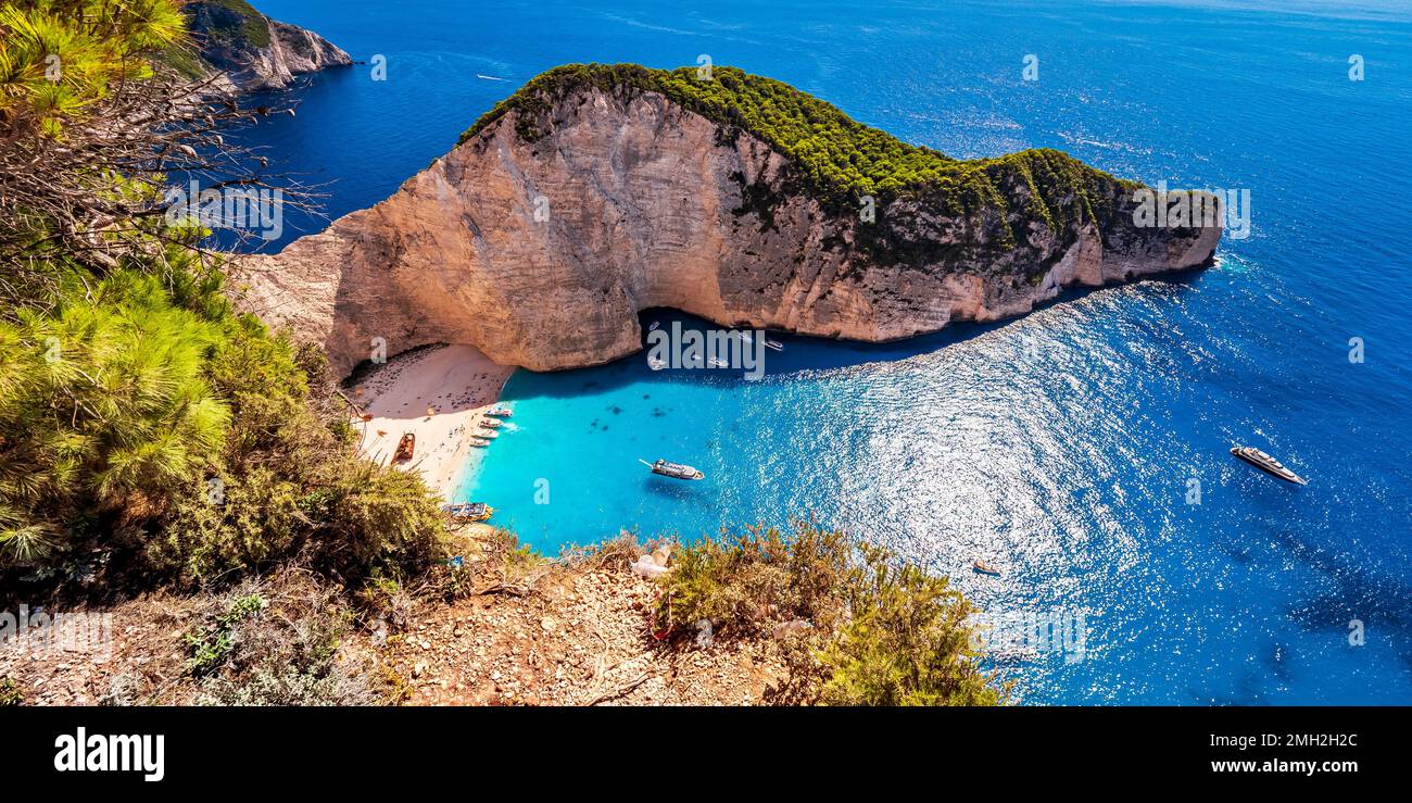 Scenic high angle panoramic view of the famous Navagio Shipwreck Beach (Smugglers Cove) on ...