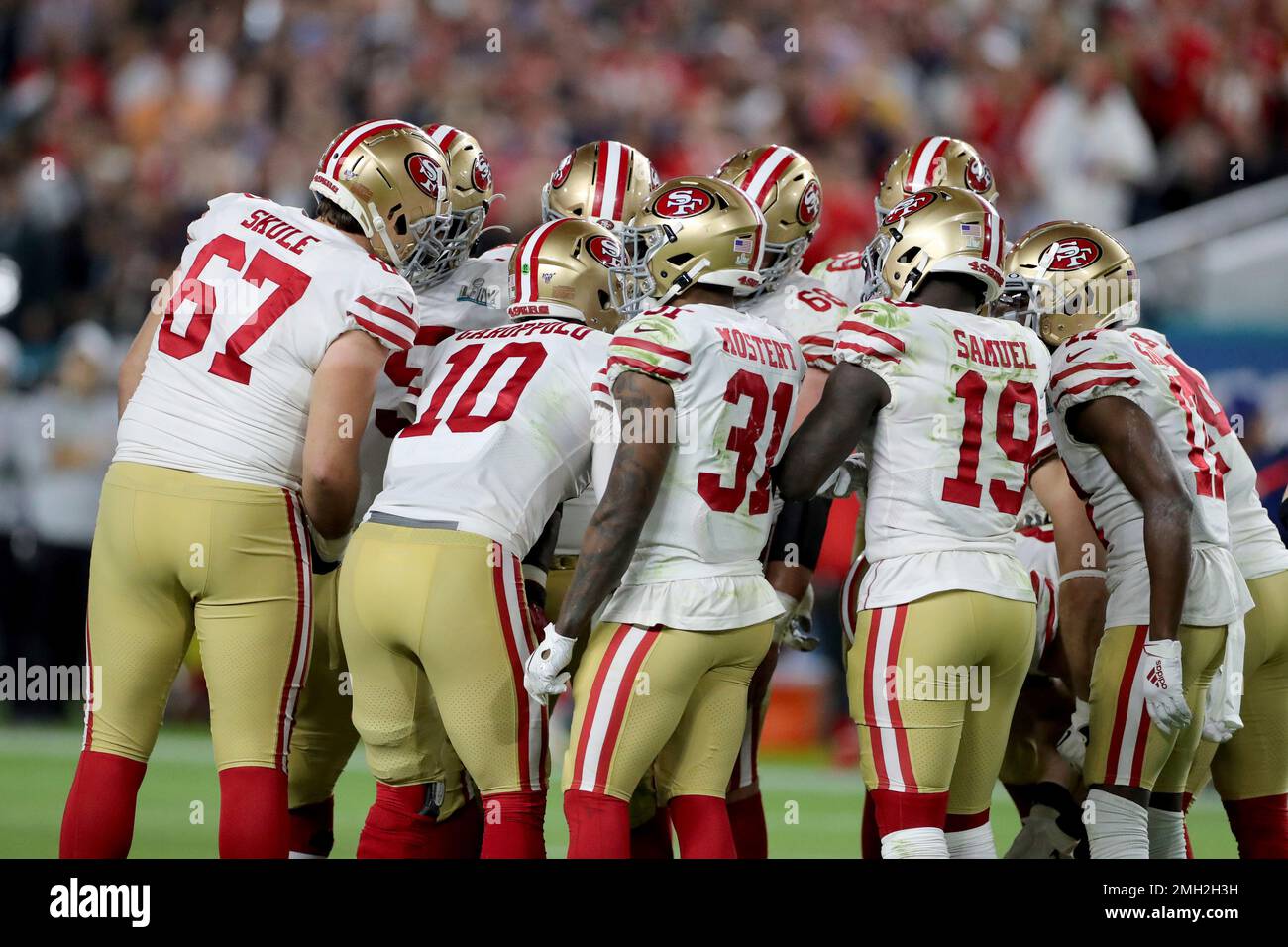 The San Francisco 49ers offense huddles against the Kansas City Chiefs ...