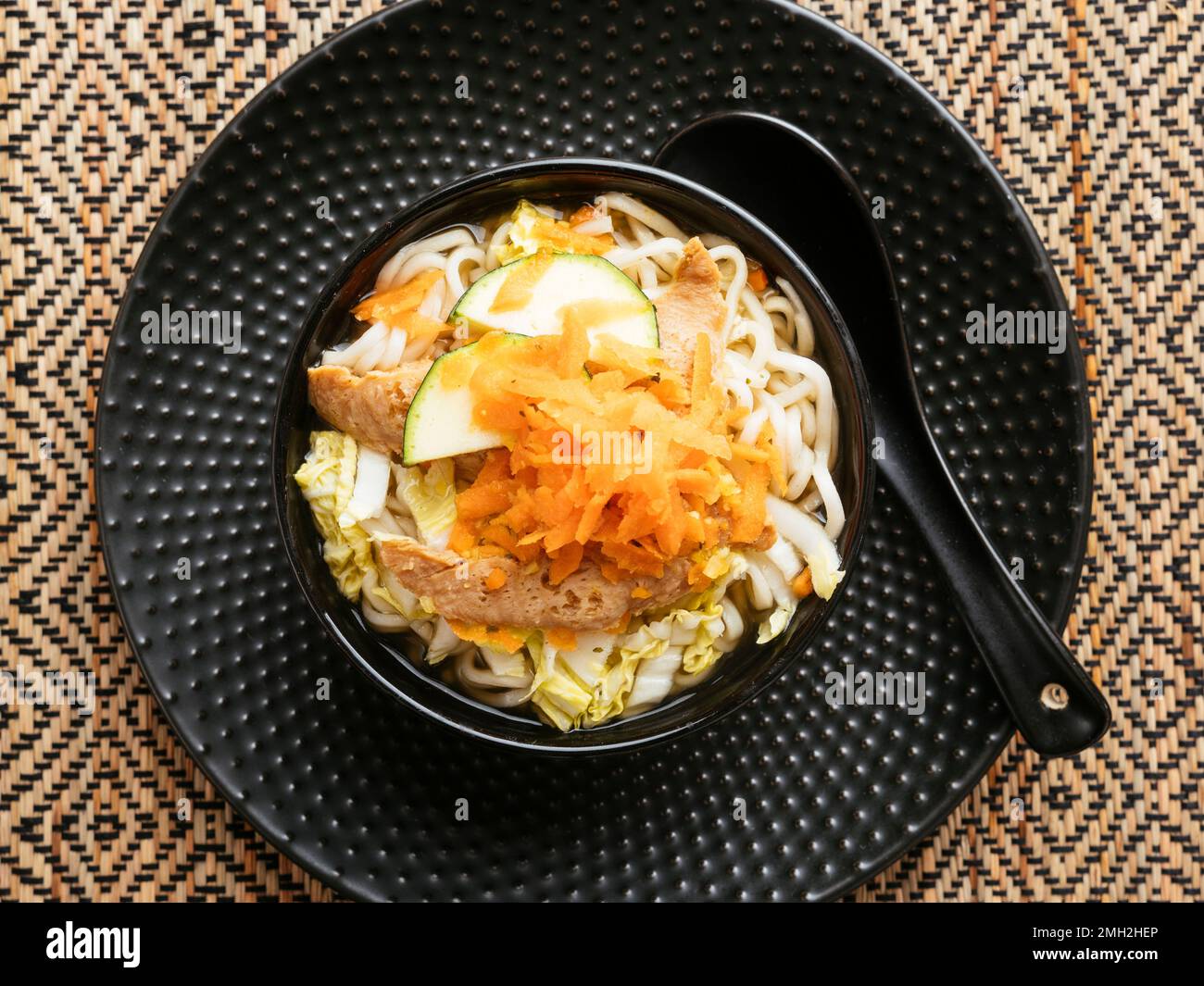 Asian soup with mie noodles, TVP, cabbage, zucchini and shredded ...