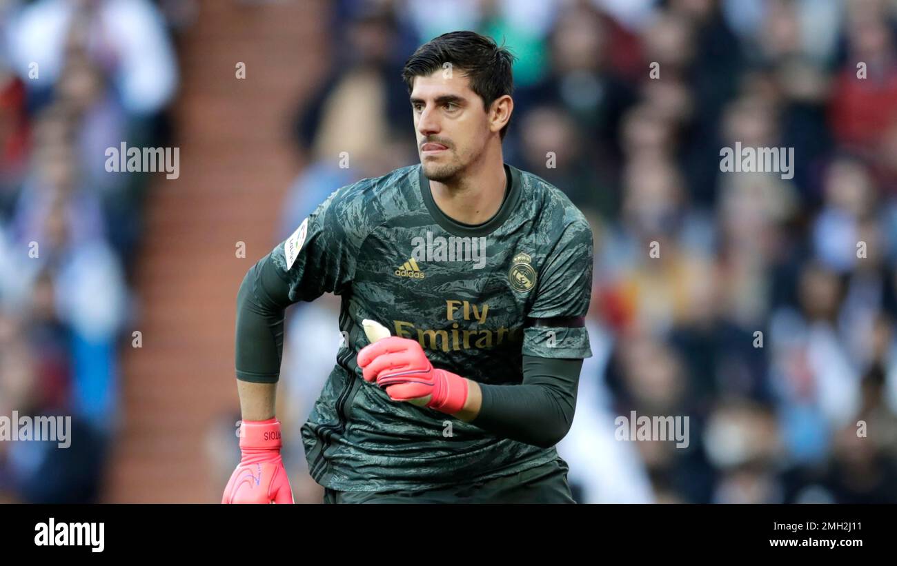 Real Madrid's goalkeeper Thibaut Courtois controls the ball during a ...