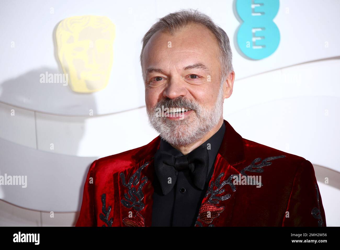Host Graham Norton poses for photographers upon arrival at the Bafta ...