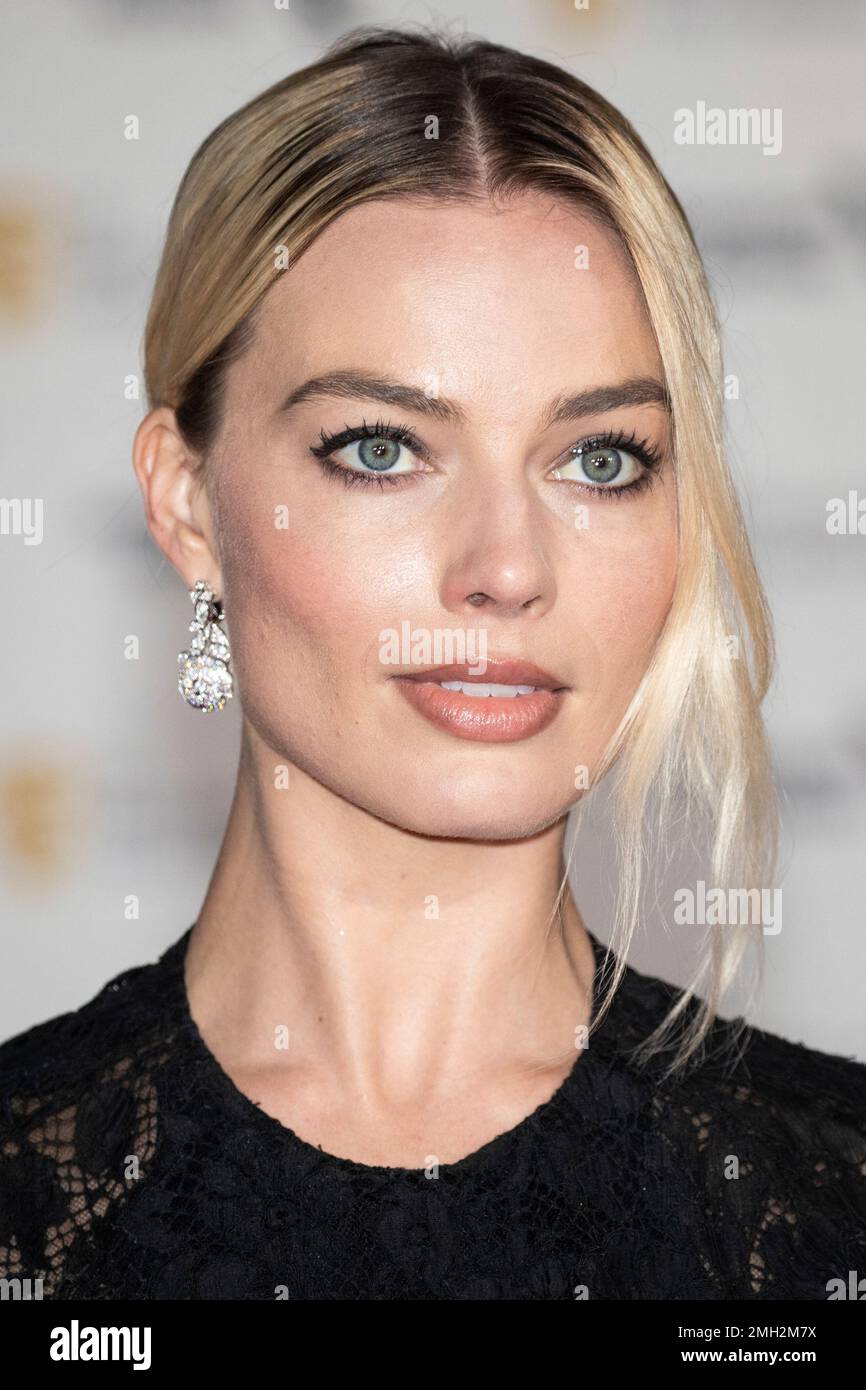 Margot Robbie poses for photographers upon arrival at the BAFTA Film ...