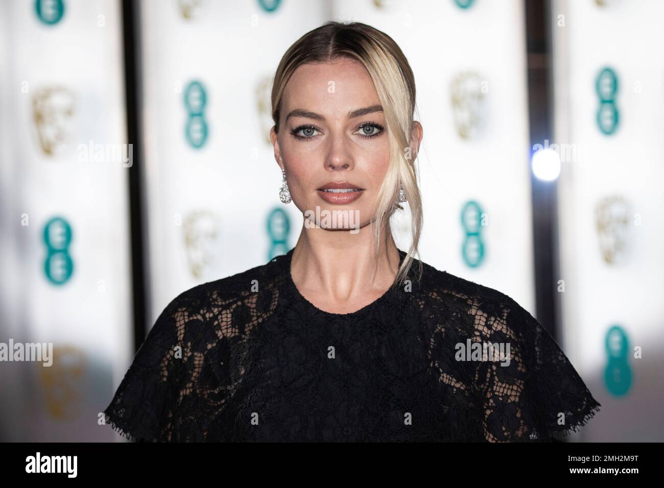 Margot Robbie poses for photographers upon arrival at the BAFTA Film ...