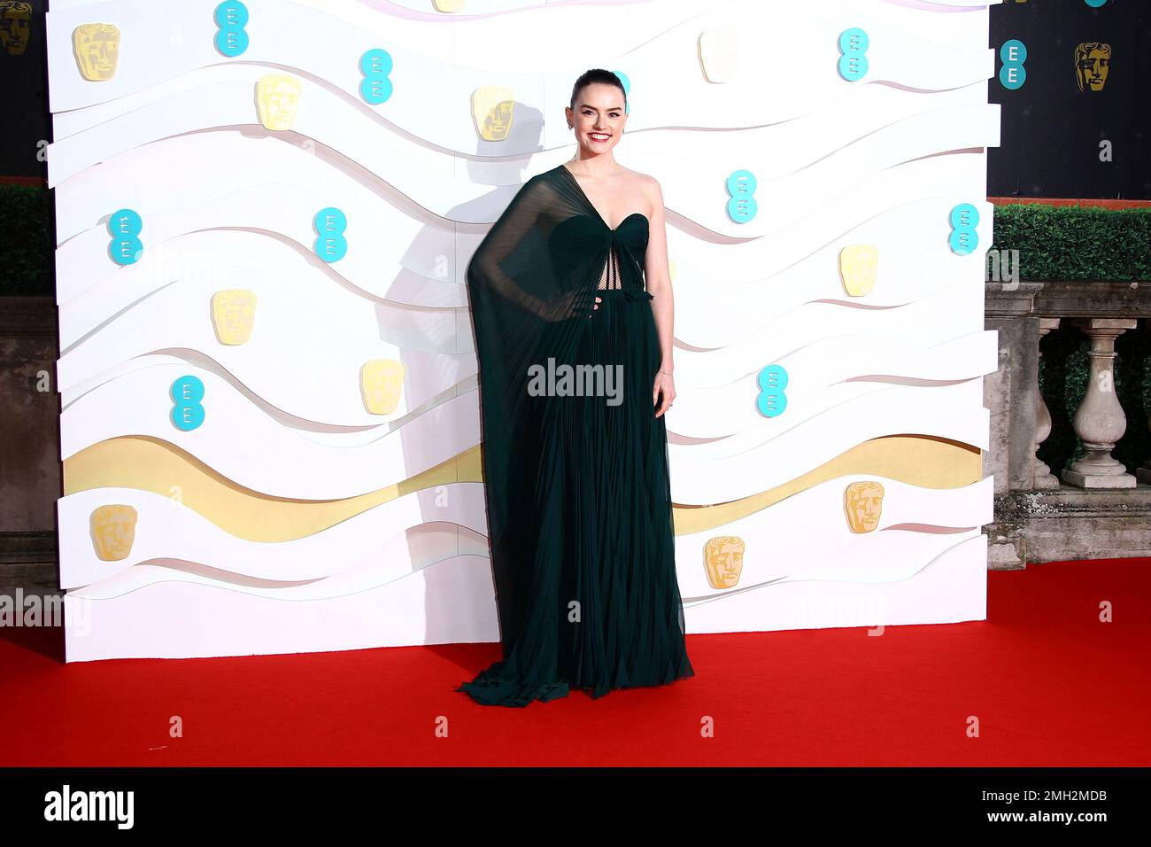 Actress Daisy Ridley poses for photographers upon arrival at the Bafta ...