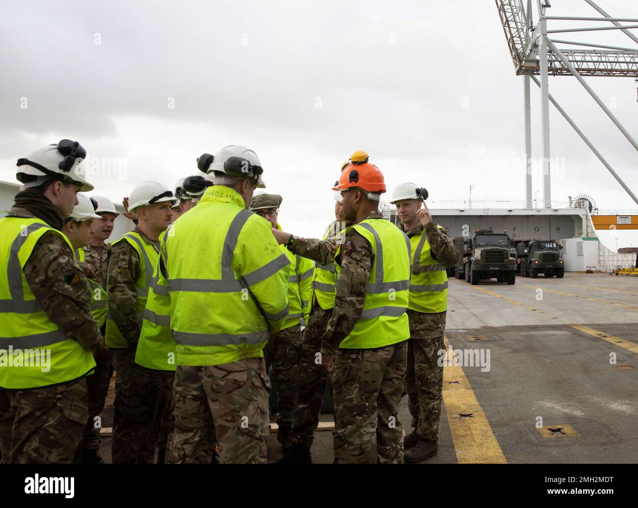 Soldiers discuss how to move heavy equipment and vehicles from a ...