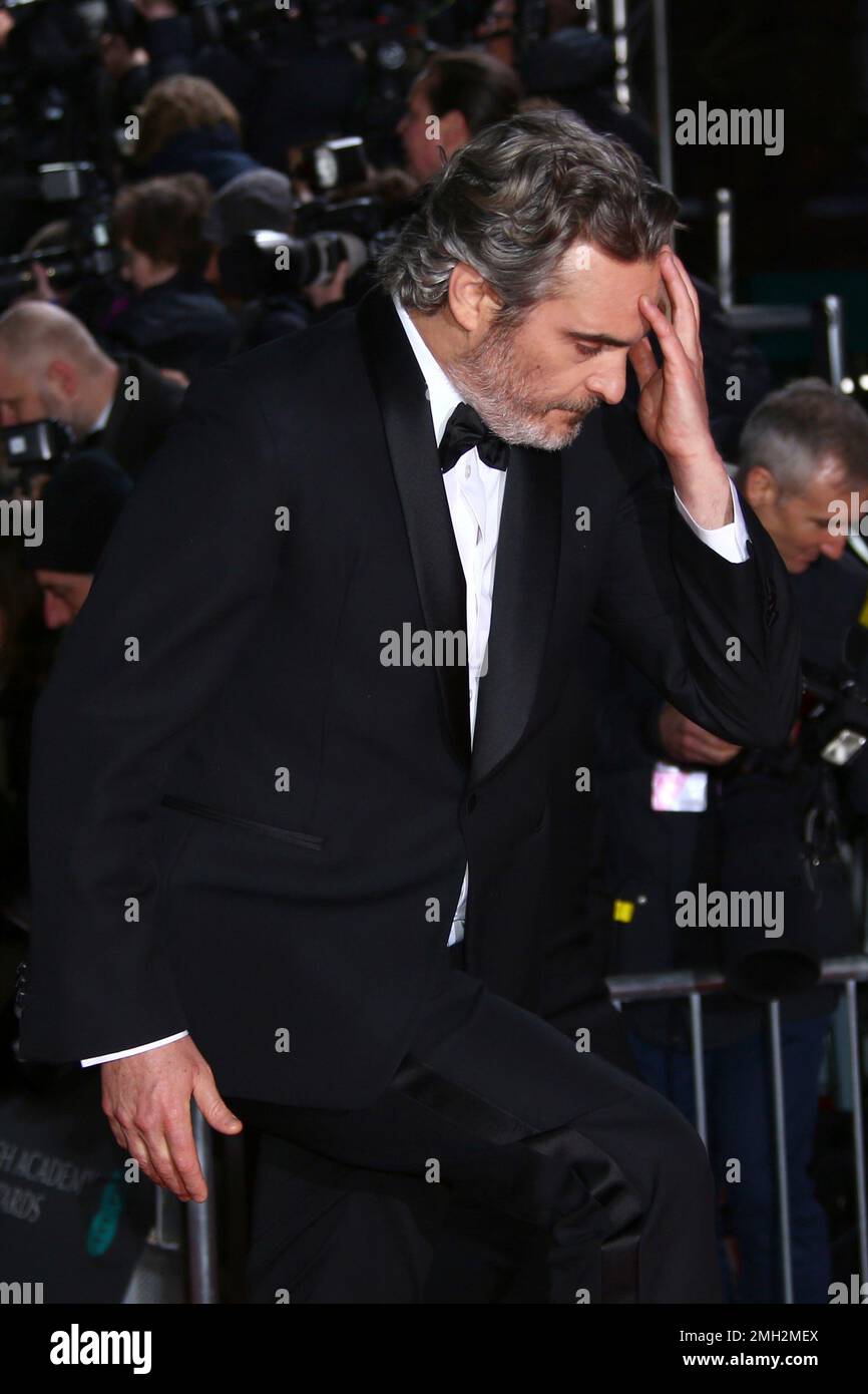 Actor Joaquin Phoenix poses for photographers upon arrival at the Bafta ...