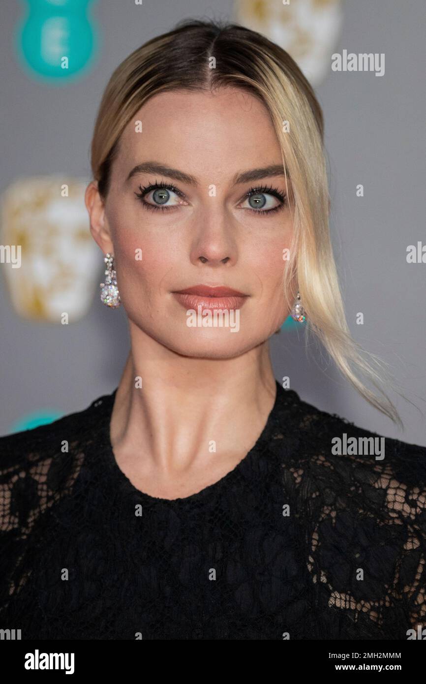 Actress Margot Robbie poses for photographers upon arrival at the BAFTA ...