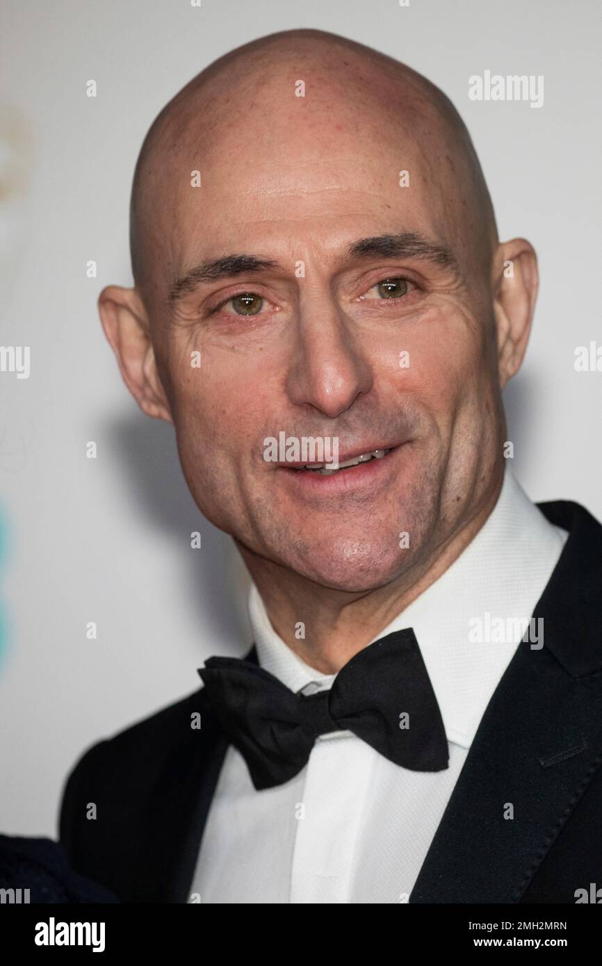 Mark Strong poses for photographers upon arrival at the Bafta Film ...