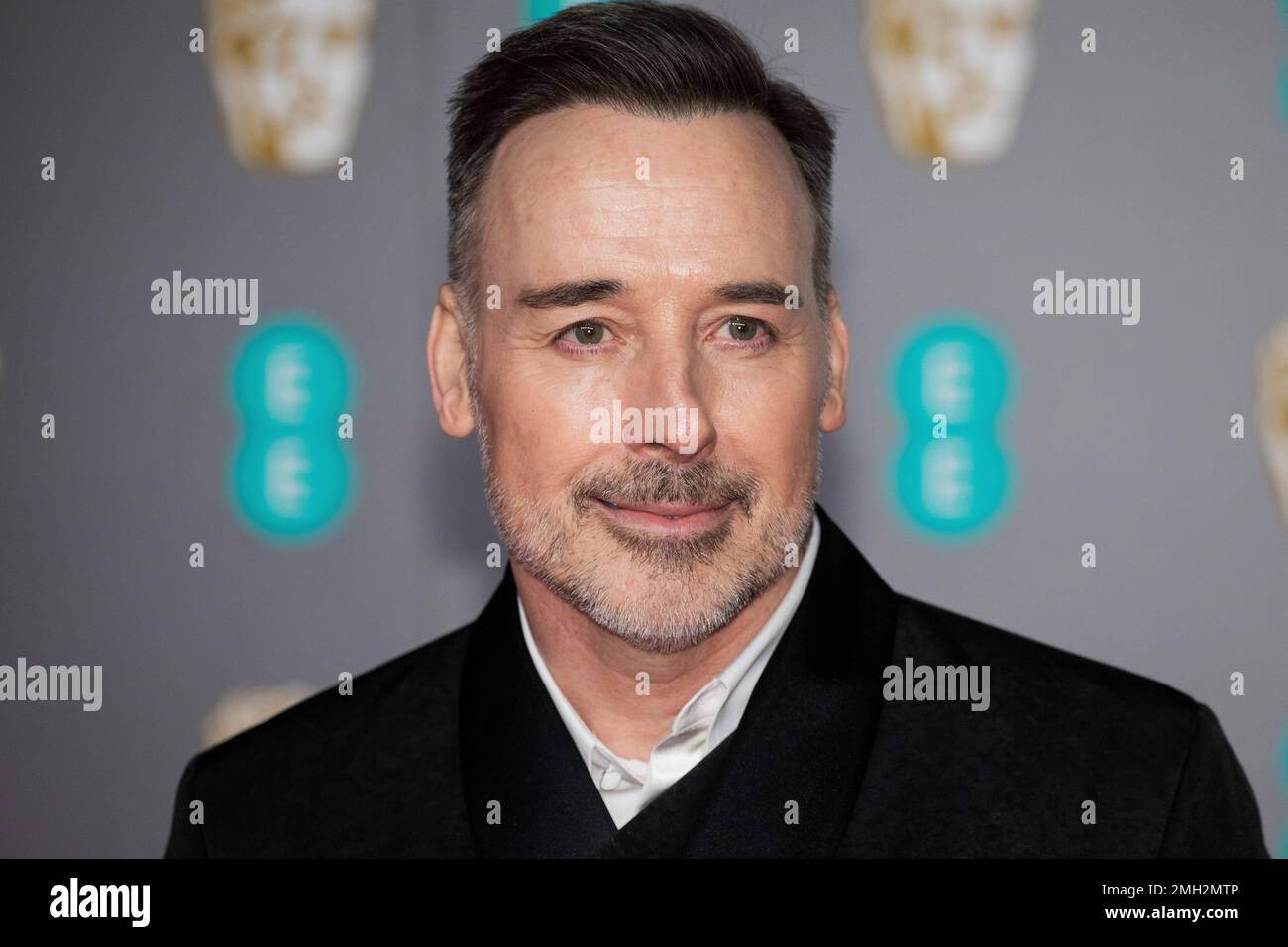 David Furnish poses for photographers upon arrival at the Bafta Film ...