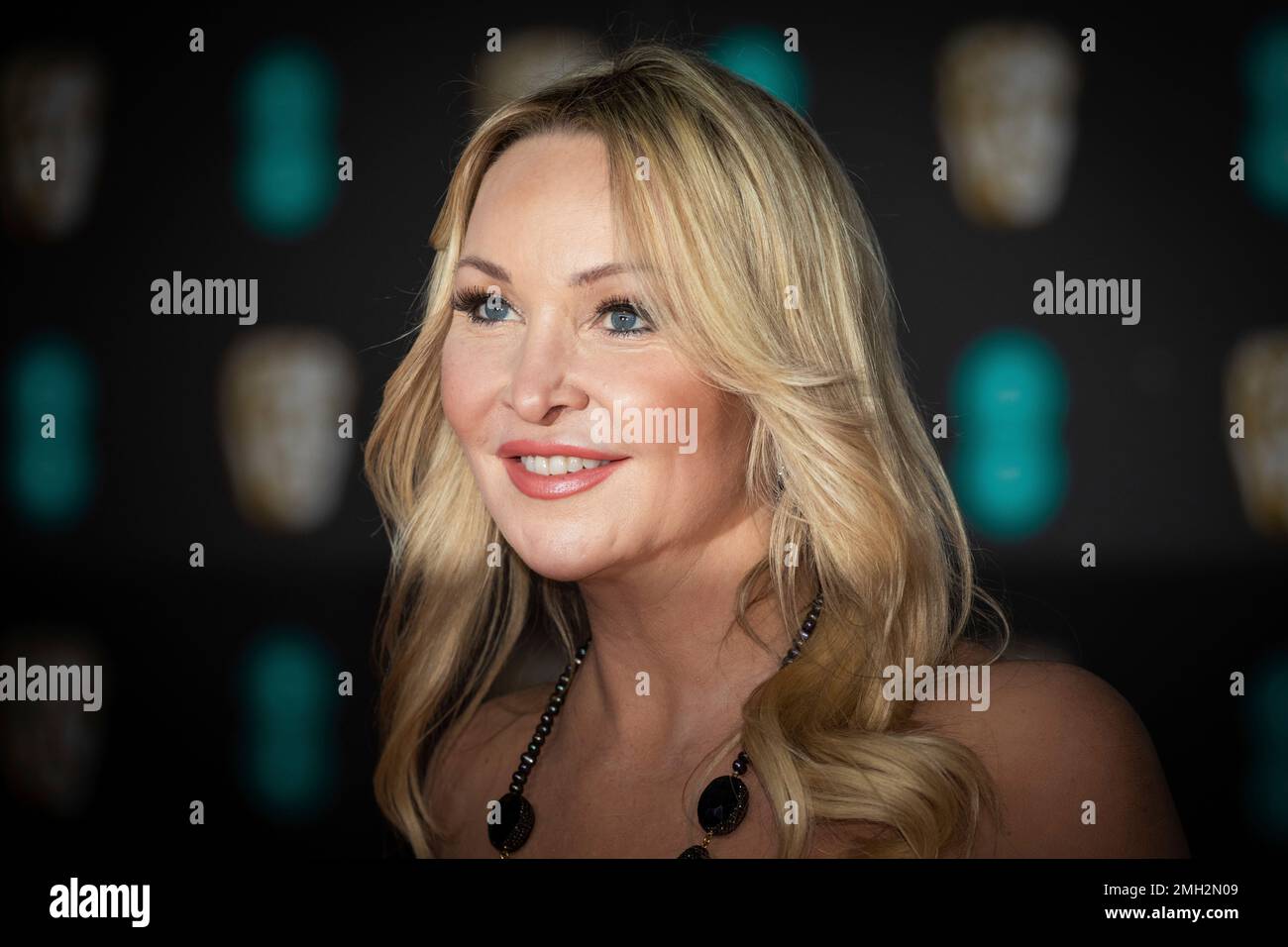 Heather Bird poses for photographers upon arrival at the Bafta Film ...