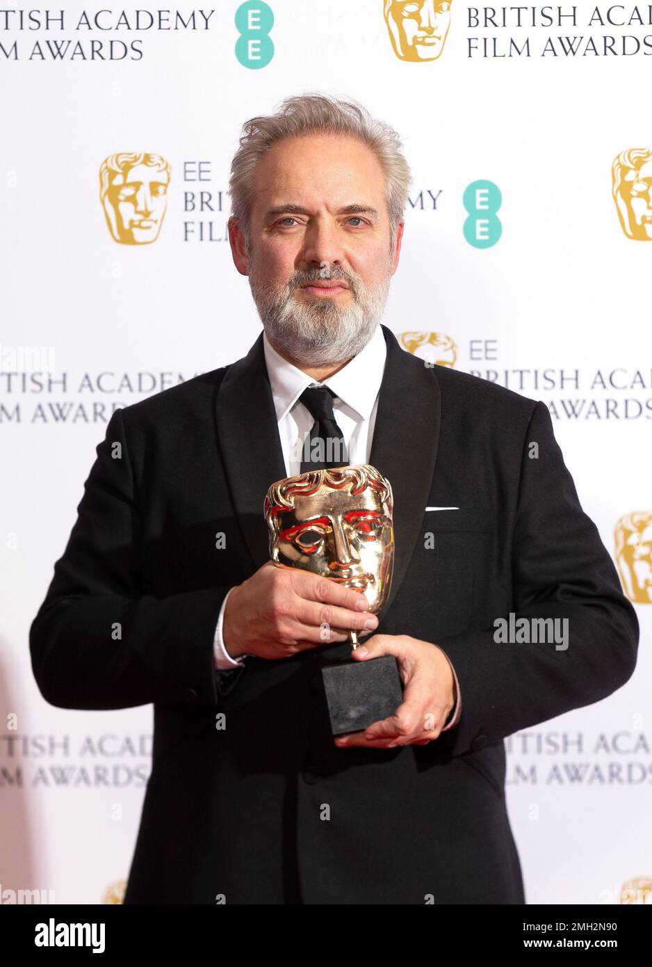 Director Sam Mendes poses with the Best Director award for 1917 ...
