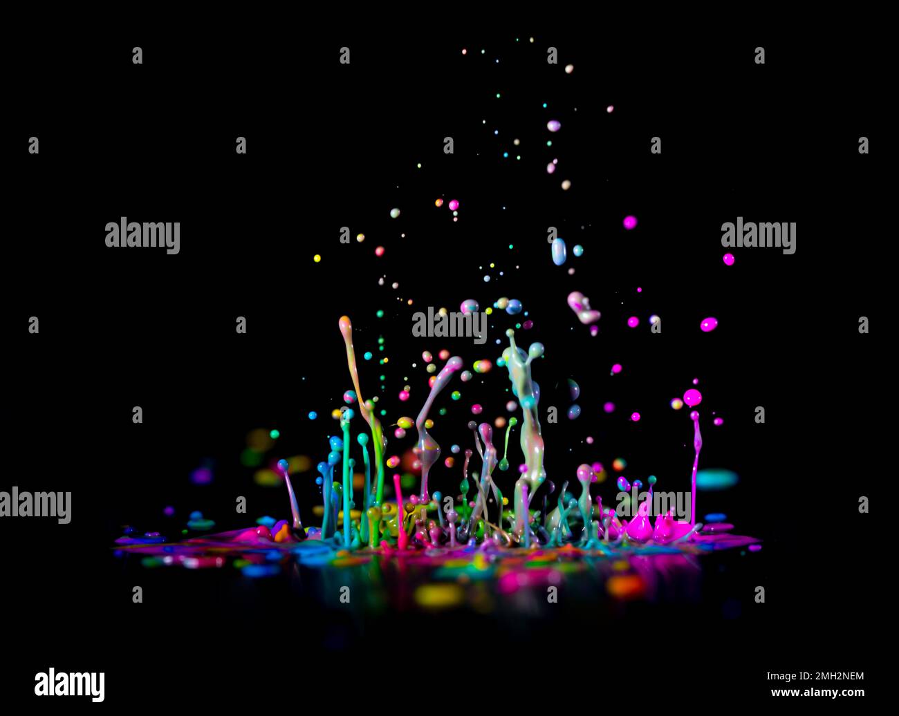 splash of multi-colored ink on a black background. paint explosion ...