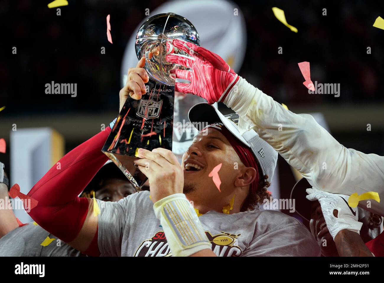 Kansas City Chiefs' Patrick Mahomes hoists the trophy after defeating ...