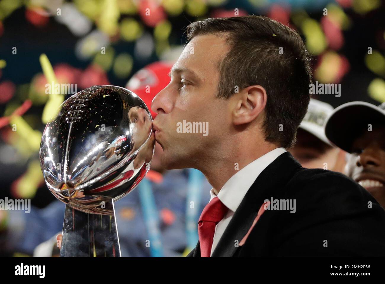Kansas City Chiefs General Manager Brett Veach kisses the trophy after ...
