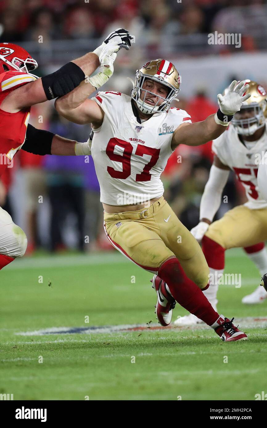 San Francisco 49ers defensive end Nick Bosa (97) fights through a block ...