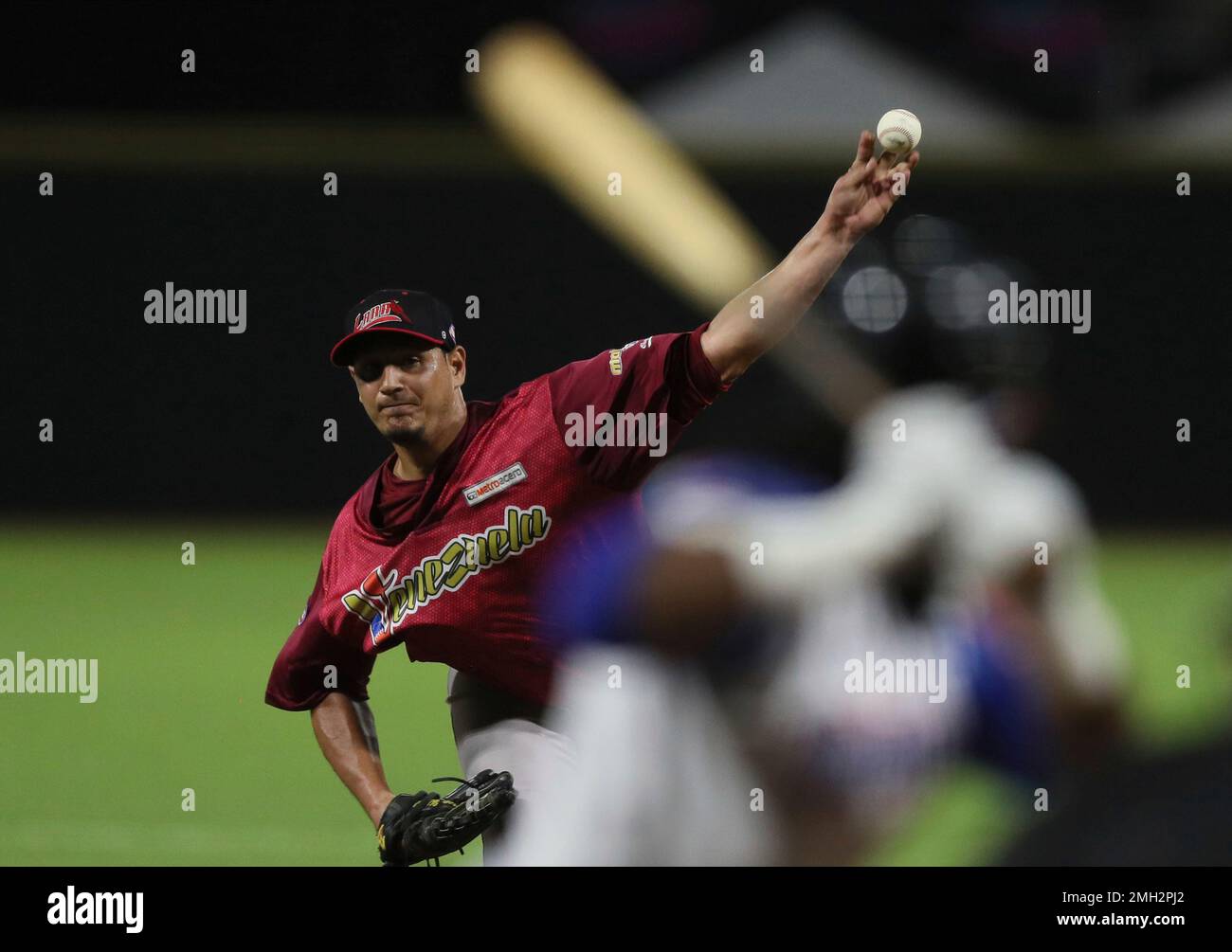 Venezuela's pitcher Wilfredo Ledezma throws the ball at the first ...