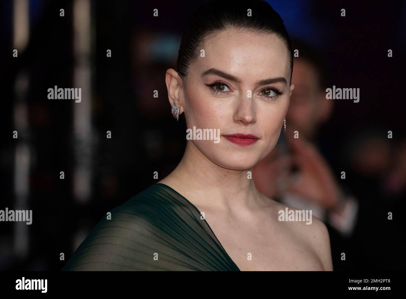 Daisy Ridley poses for photographers upon arrival at the Bafta Film ...