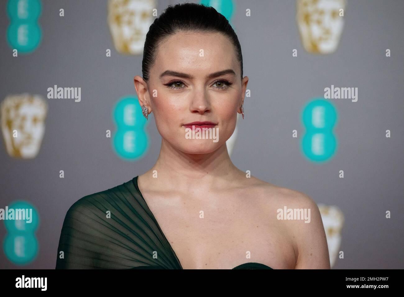 Daisy Ridley poses for photographers upon arrival at the Bafta Film ...