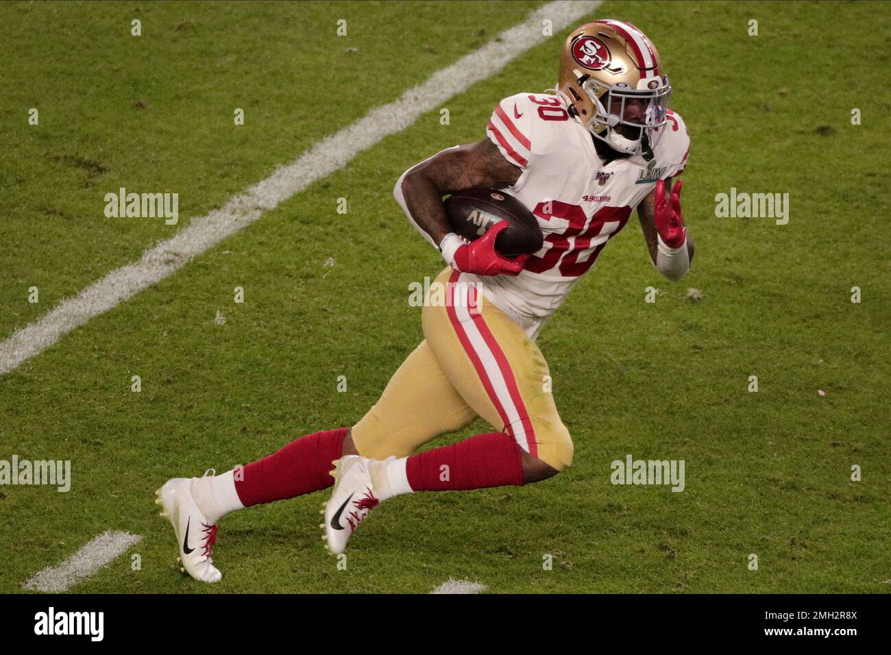 San Francisco 49ers' Jeff Wilson Jr. (30) carries the ball, during the ...