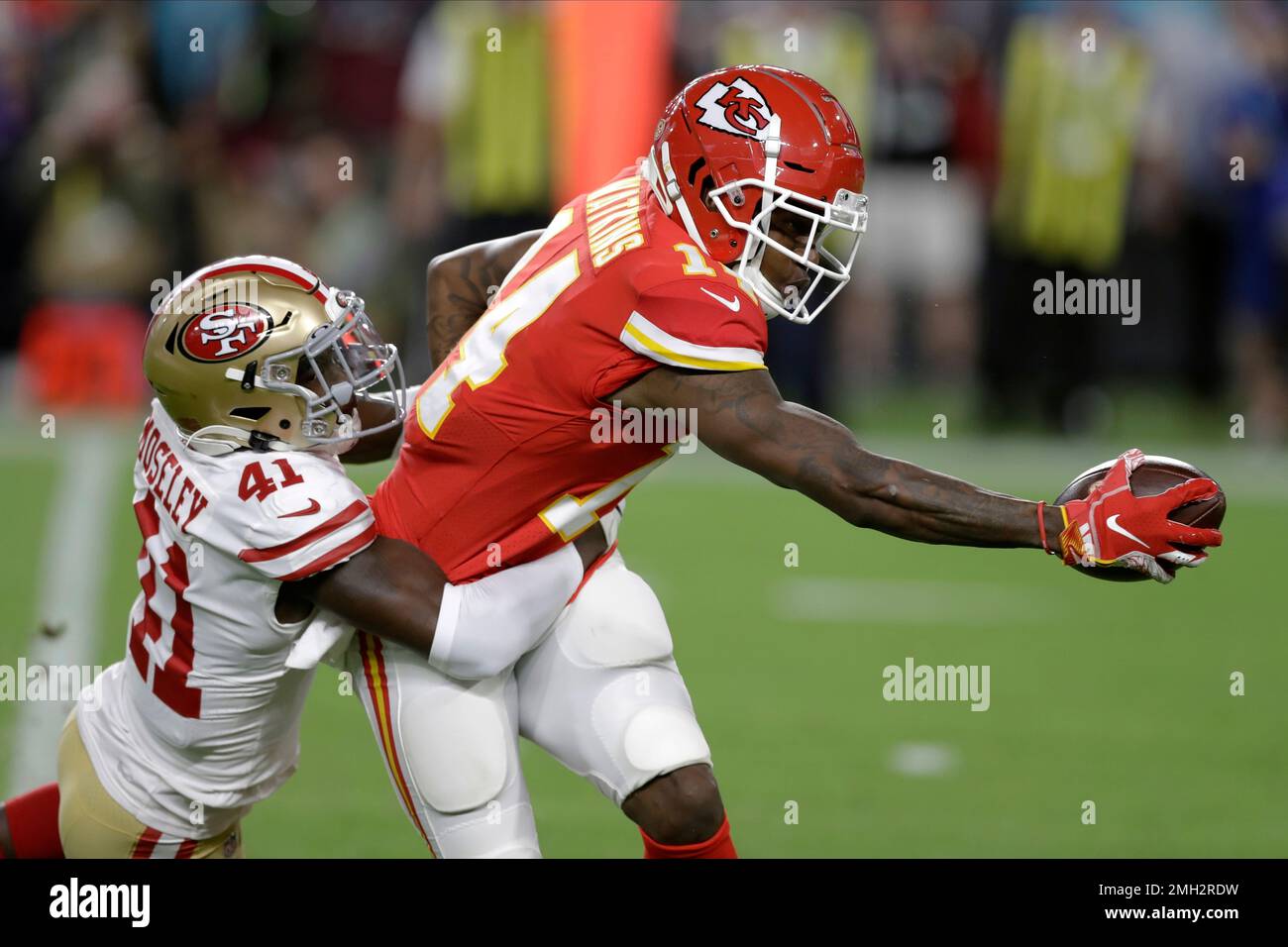San Francisco 49ers defensive back Emmanuel Moseley, left, tackles ...