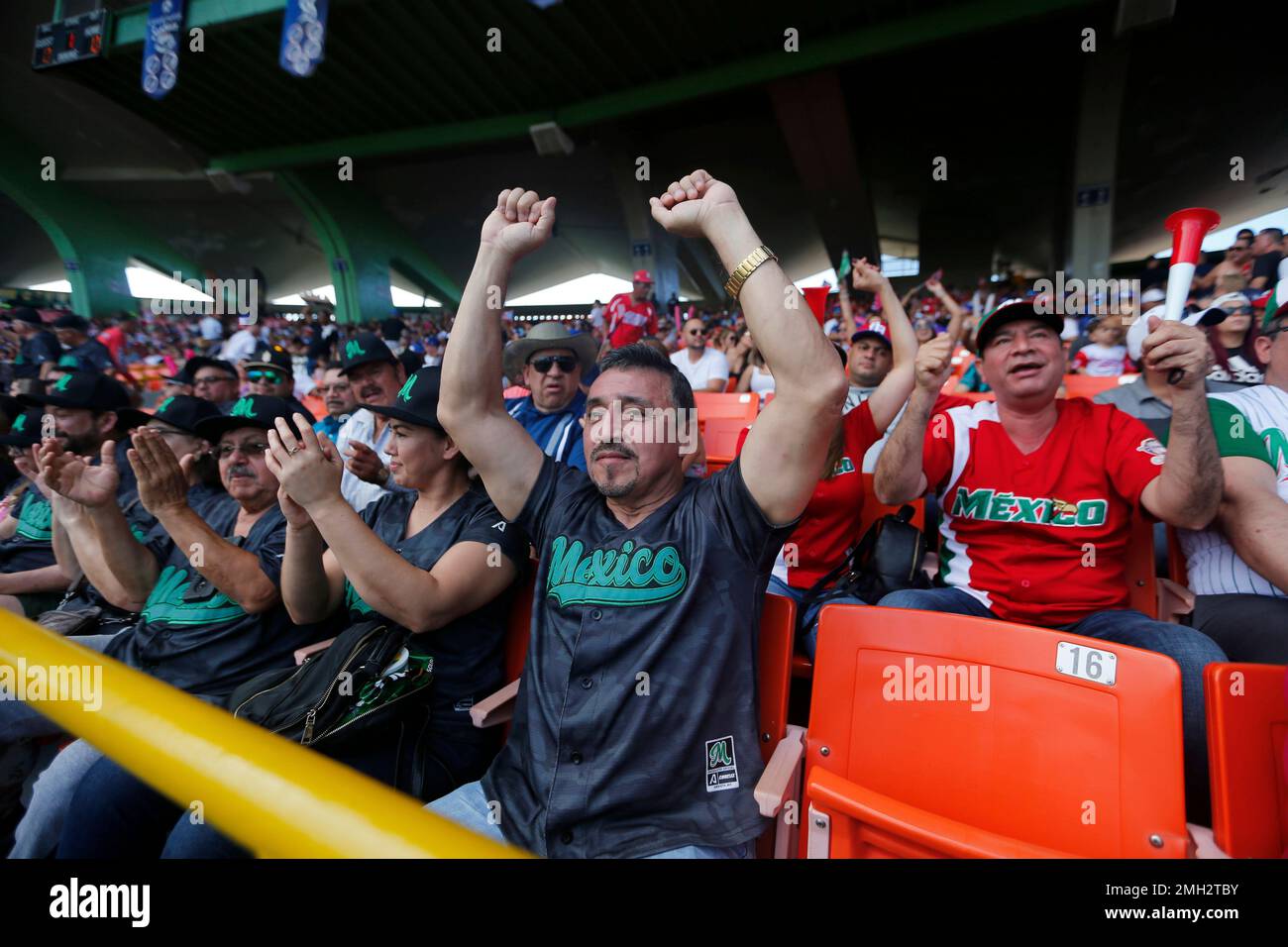 Mexican fans cheer their team prior a Caribbean Series baseball game ...