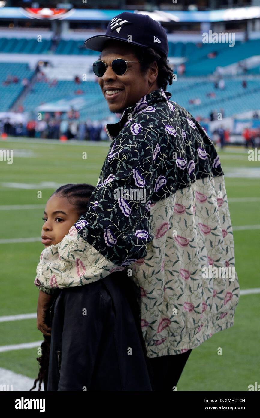 Entertainer Jay-Z stands with his daughter Blue Ivy Carter as they ...