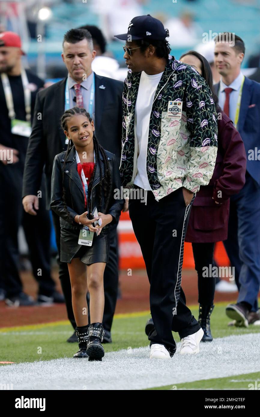 Entertainer Jay-Z walks with his daughter Blue Ivy Carter as they ...