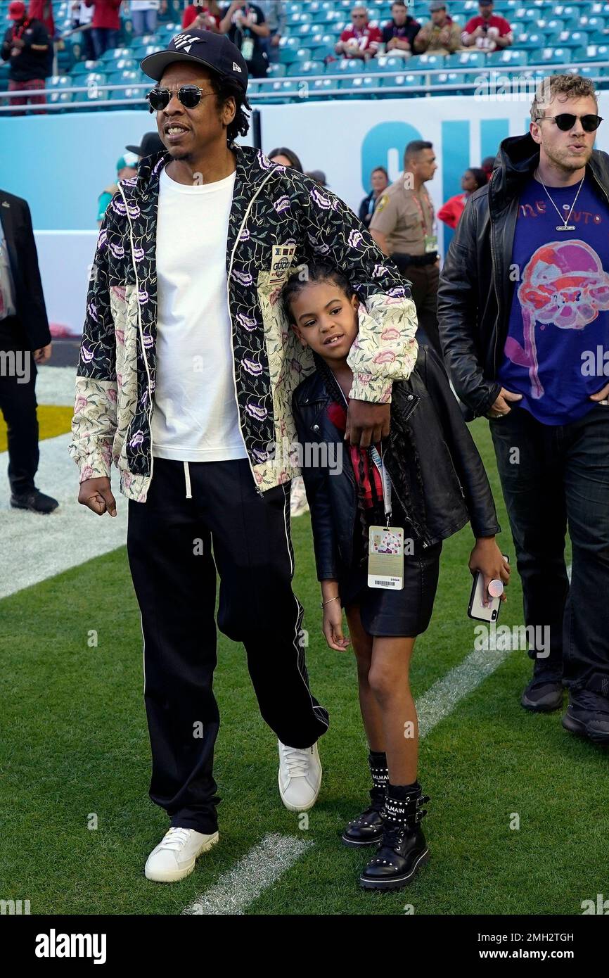 Entertainer Jay-Z walks with his daughter Blue Ivy Carter as they ...