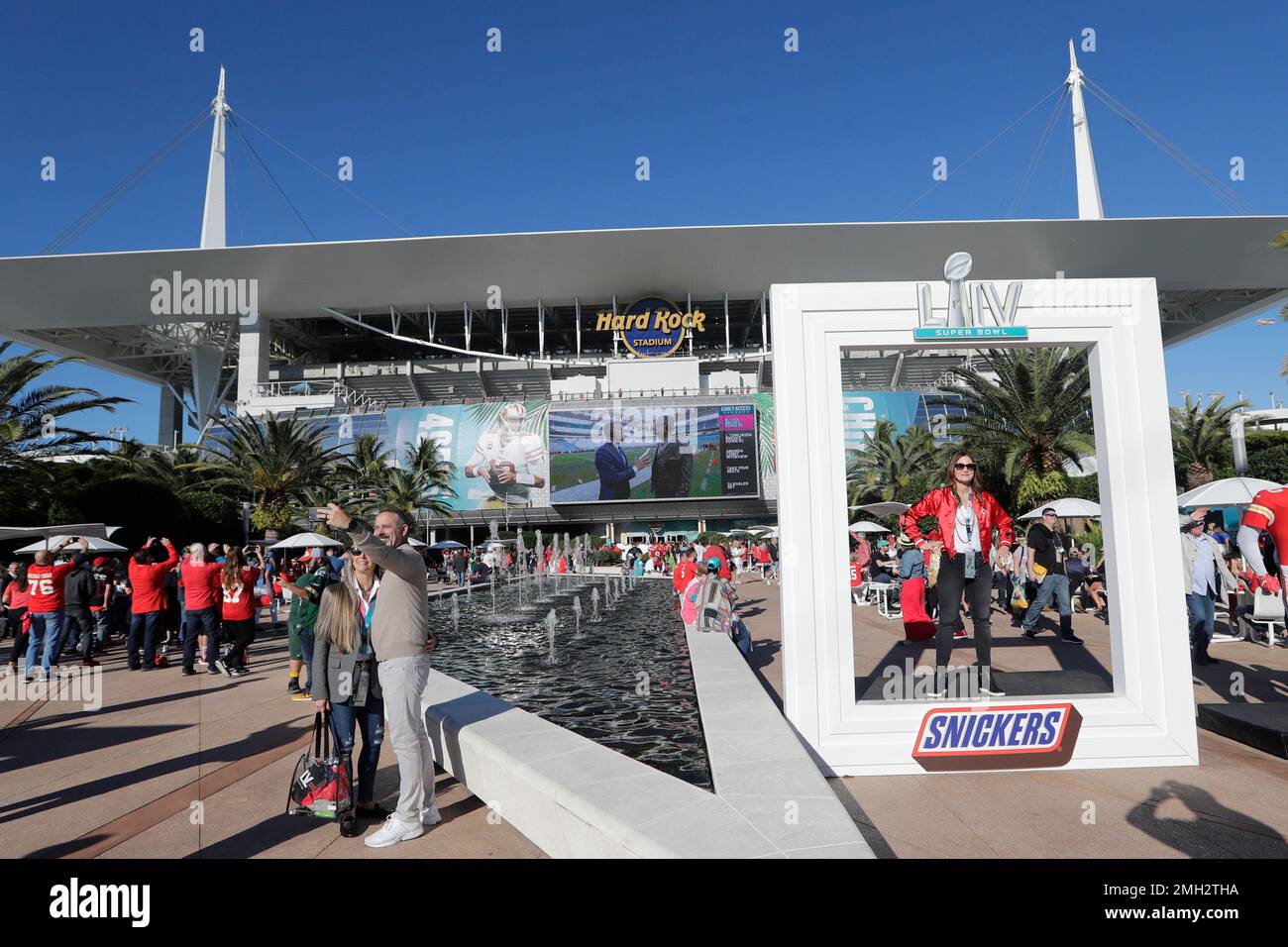 Fans move about outside of Hard Rock Stadium before the NFL Super Bowl ...
