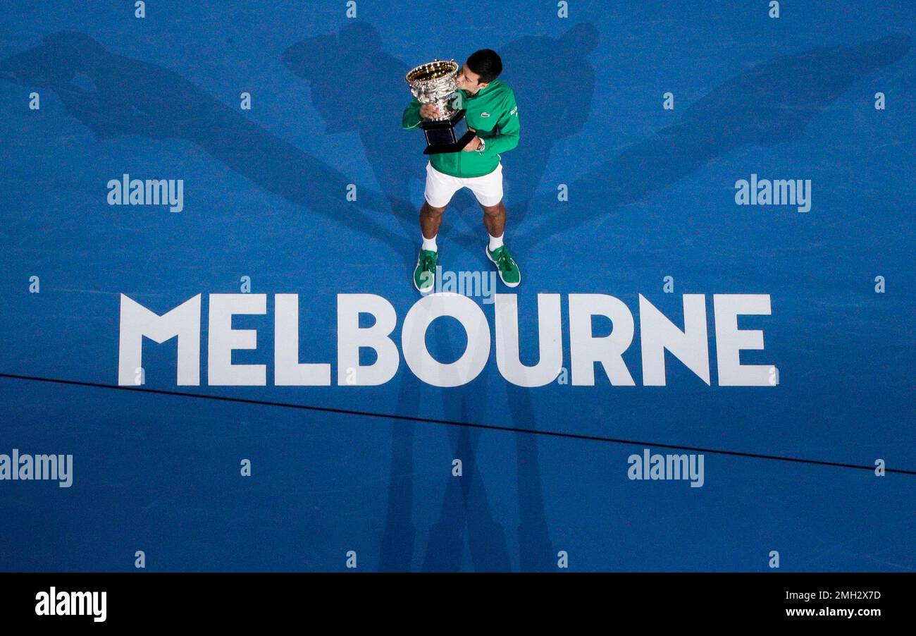 Serbia's Novak Djokovic holds the Norman Brookes Challenge Cup after ...