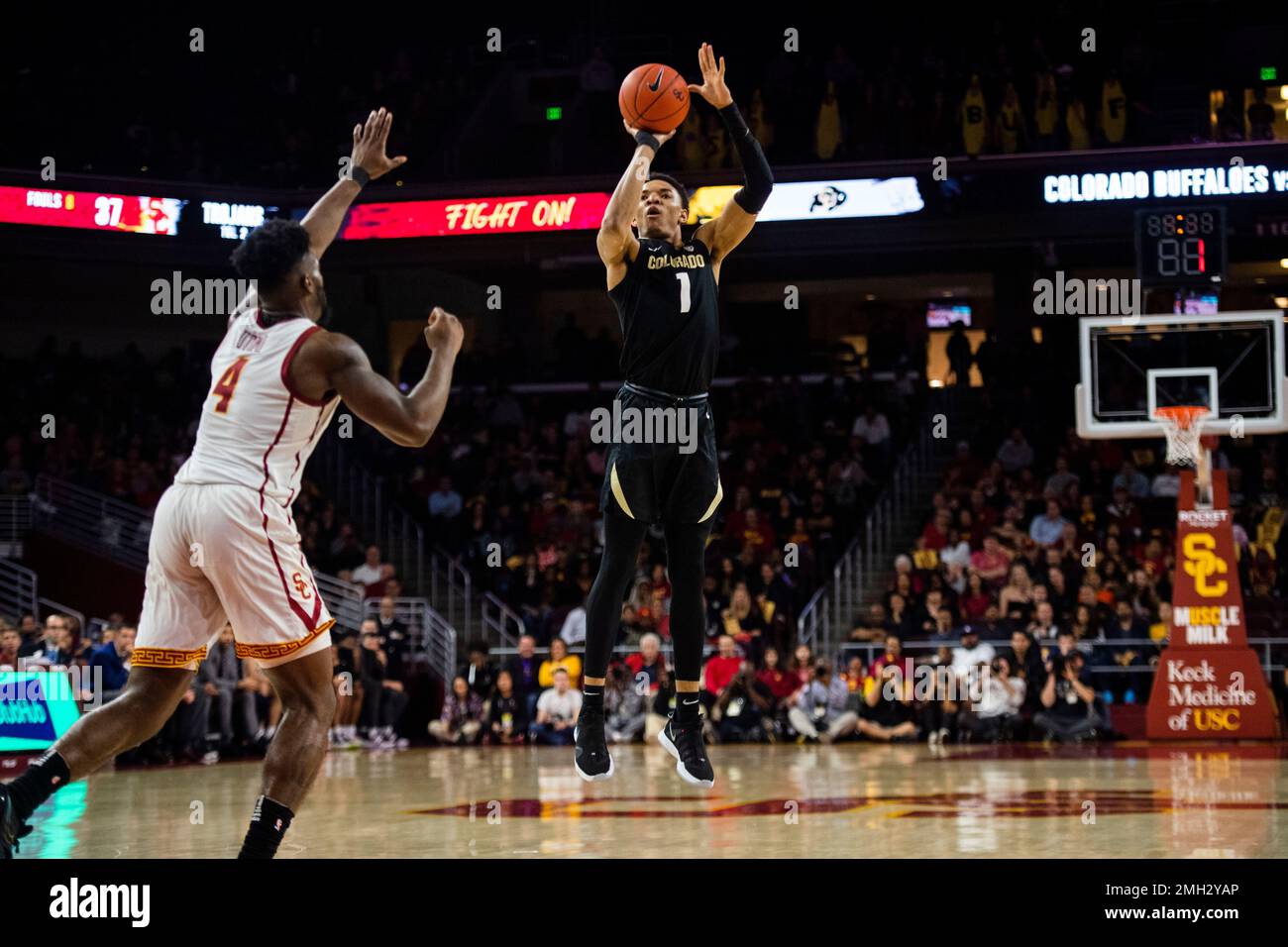 Colorado guard Tyler Bey, right, shoots a three-point basket over ...