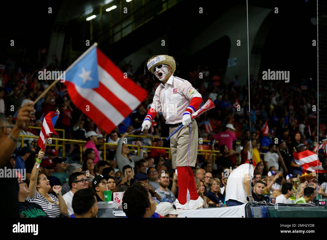 Puerto Rico's mascot cheers his team during the Caribbean Series ...