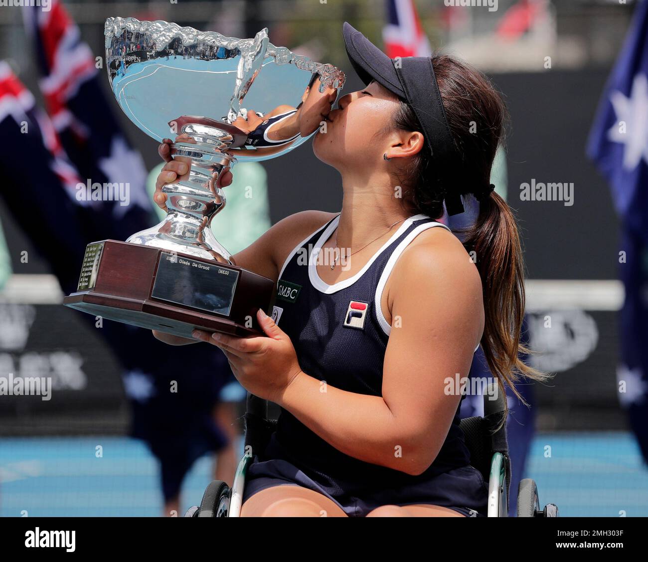 Japan's Yui Kamiji kisses her trophy after winning the women's ...